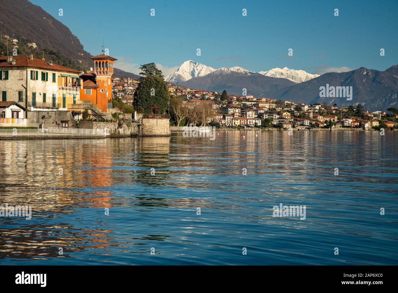 Lake Como and villages on it- reflections and shnowy mountains ...