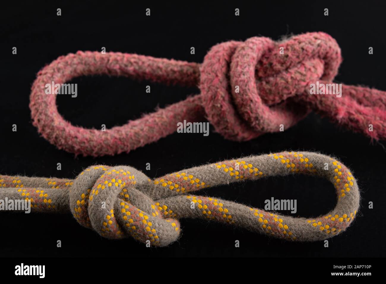 Two loops made of thick rope. Loop-shaped knot. Dark background Stock ...