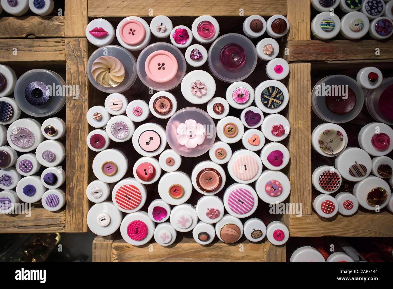 Multi-colored buttons in wooden boxes for sale in a store Stock Photo ...