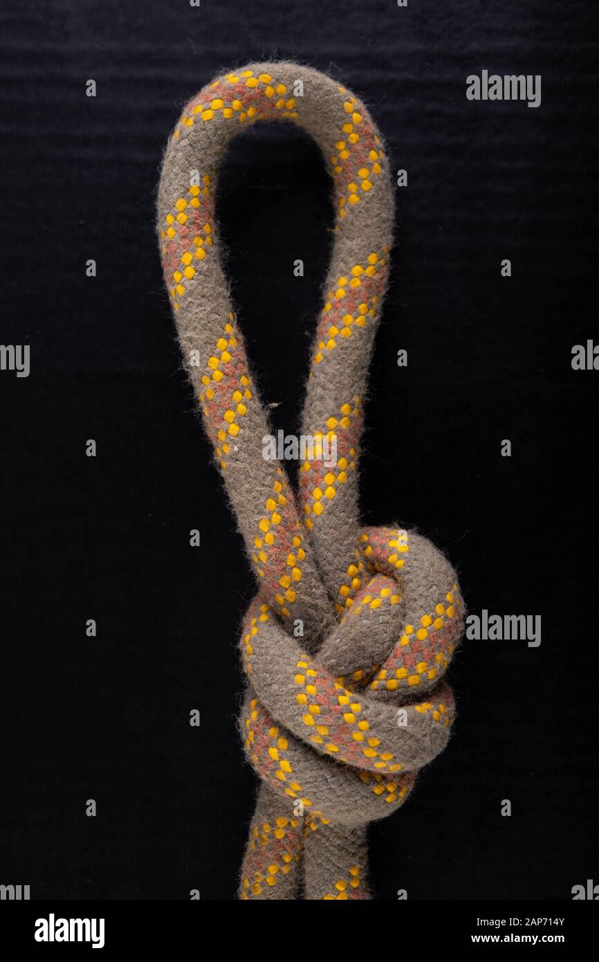 Loop made of thick rope. Loop-shaped knot. Dark background Stock Photo ...