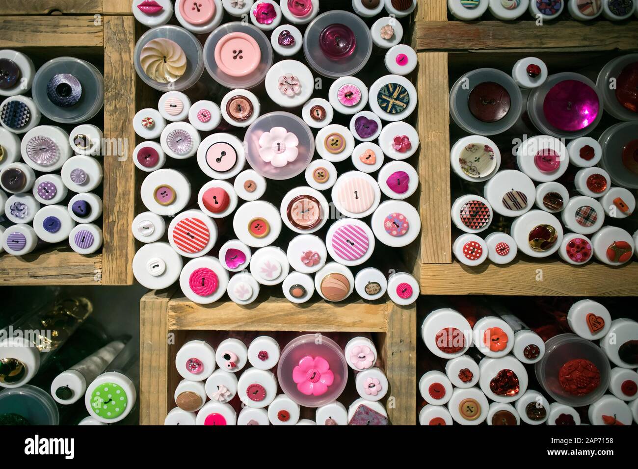 Multi-colored buttons in wooden boxes for sale in a store Stock Photo ...