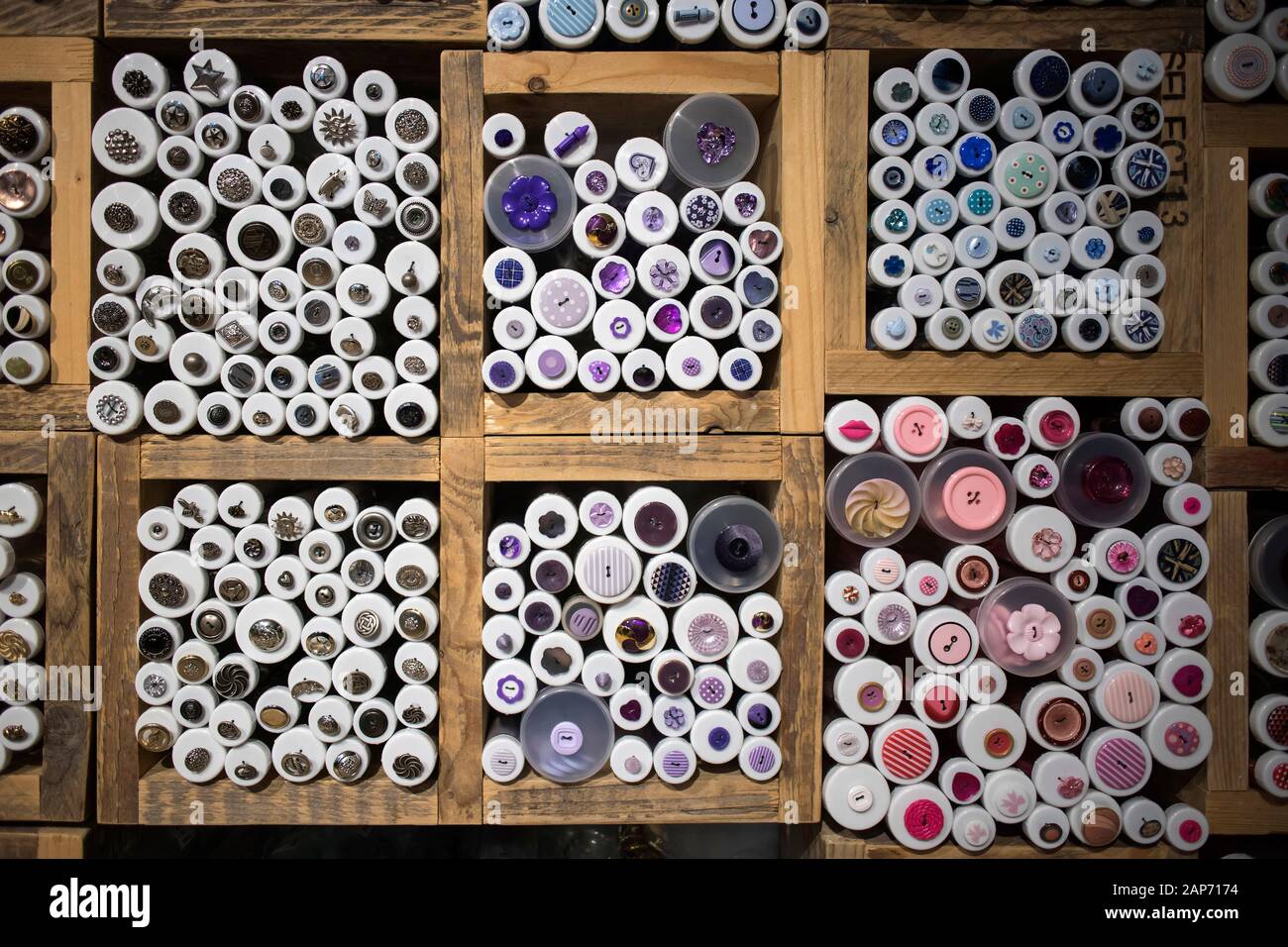 Multi-colored buttons in wooden boxes for sale in a store Stock Photo ...