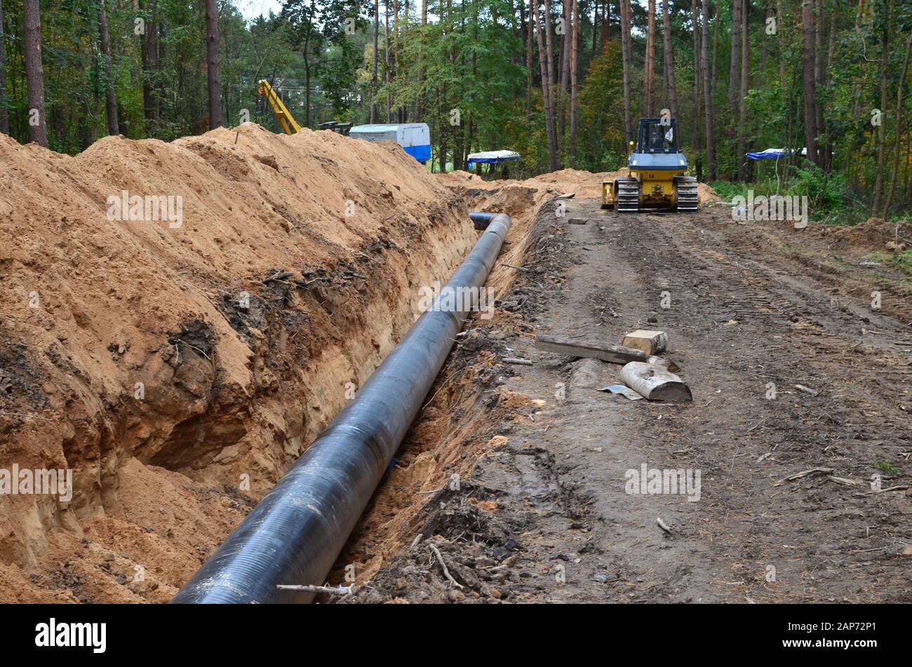 Natural gas pipeline construction work. A dug trench in the ground for ...