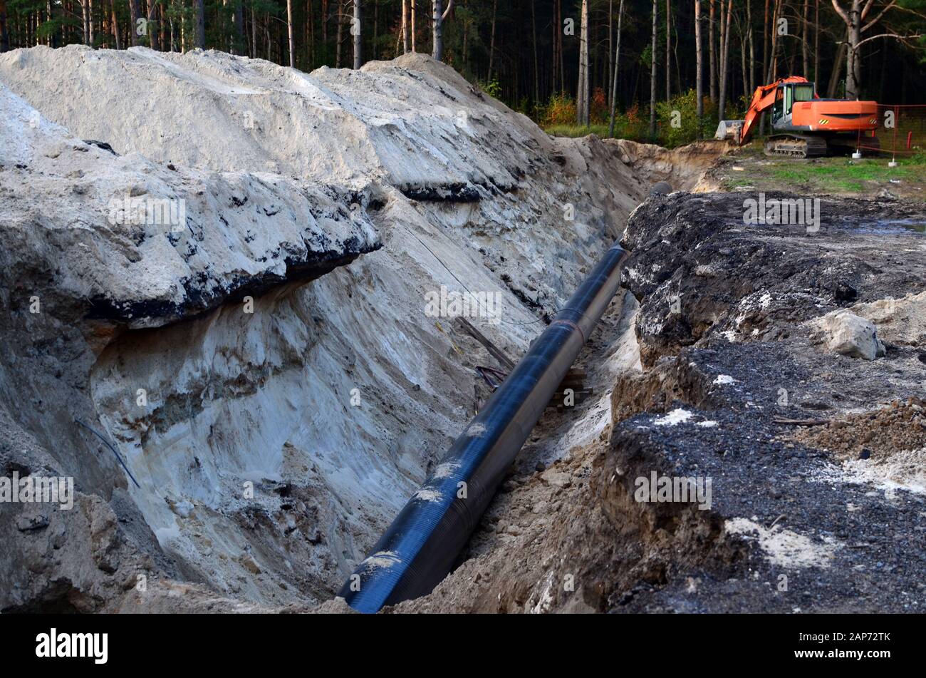 Natural gas pipeline construction work. A dug trench in the ground for ...