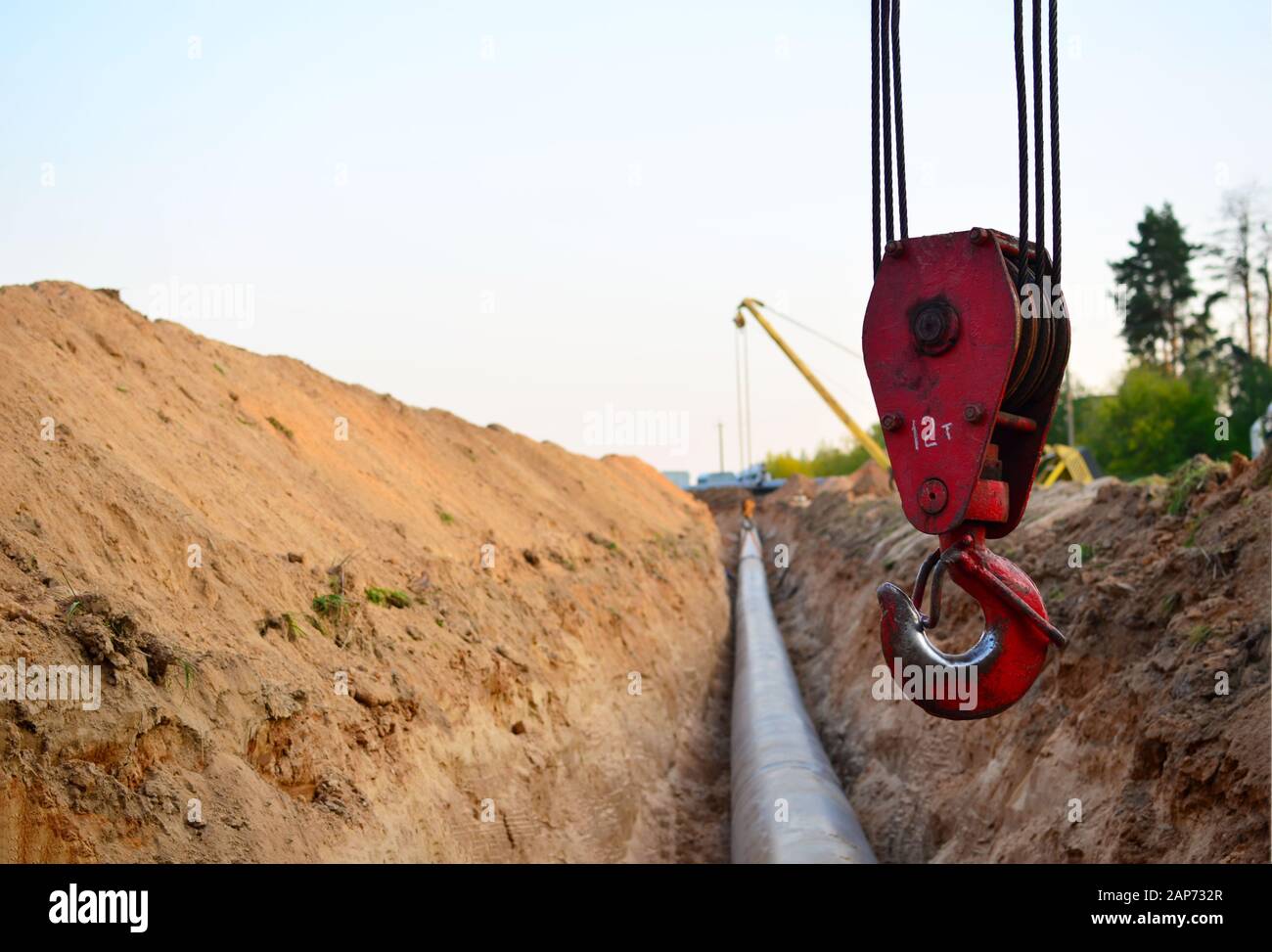 Natural gas pipeline construction work. A dug trench in the ground for ...