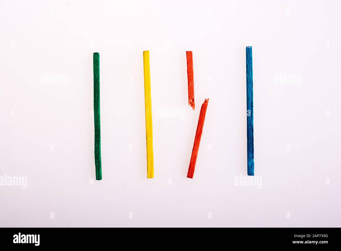 Colorful sticks with broken one in the middle on white Stock Photo - Alamy