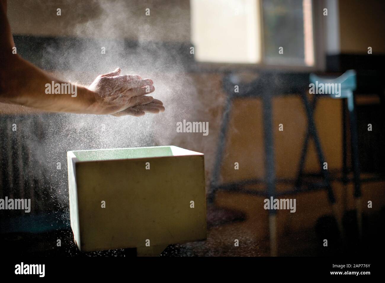 Hands rubbing chalk over themselves inside a room Stock Photo - Alamy