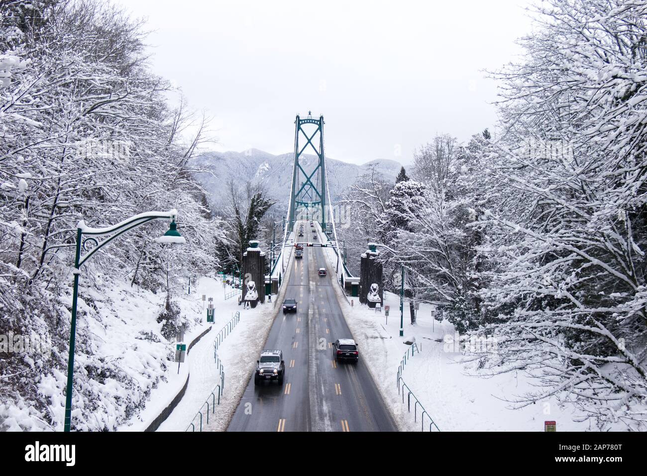 A View of Lions Gate Bridge covered in snow. Snow storm and extreme ...
