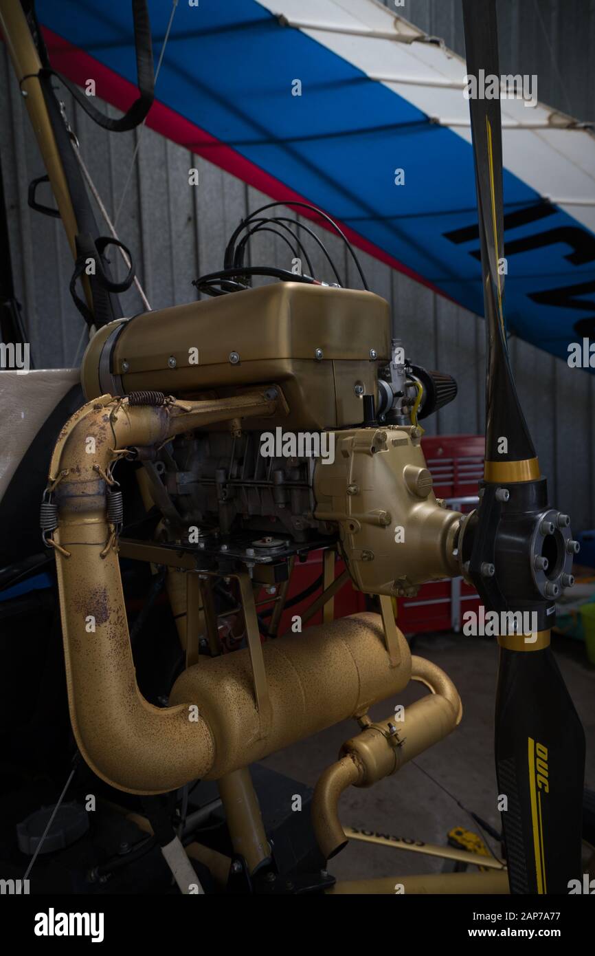 Microlight Ultralight aircraft gold engine Stock Photo - Alamy
