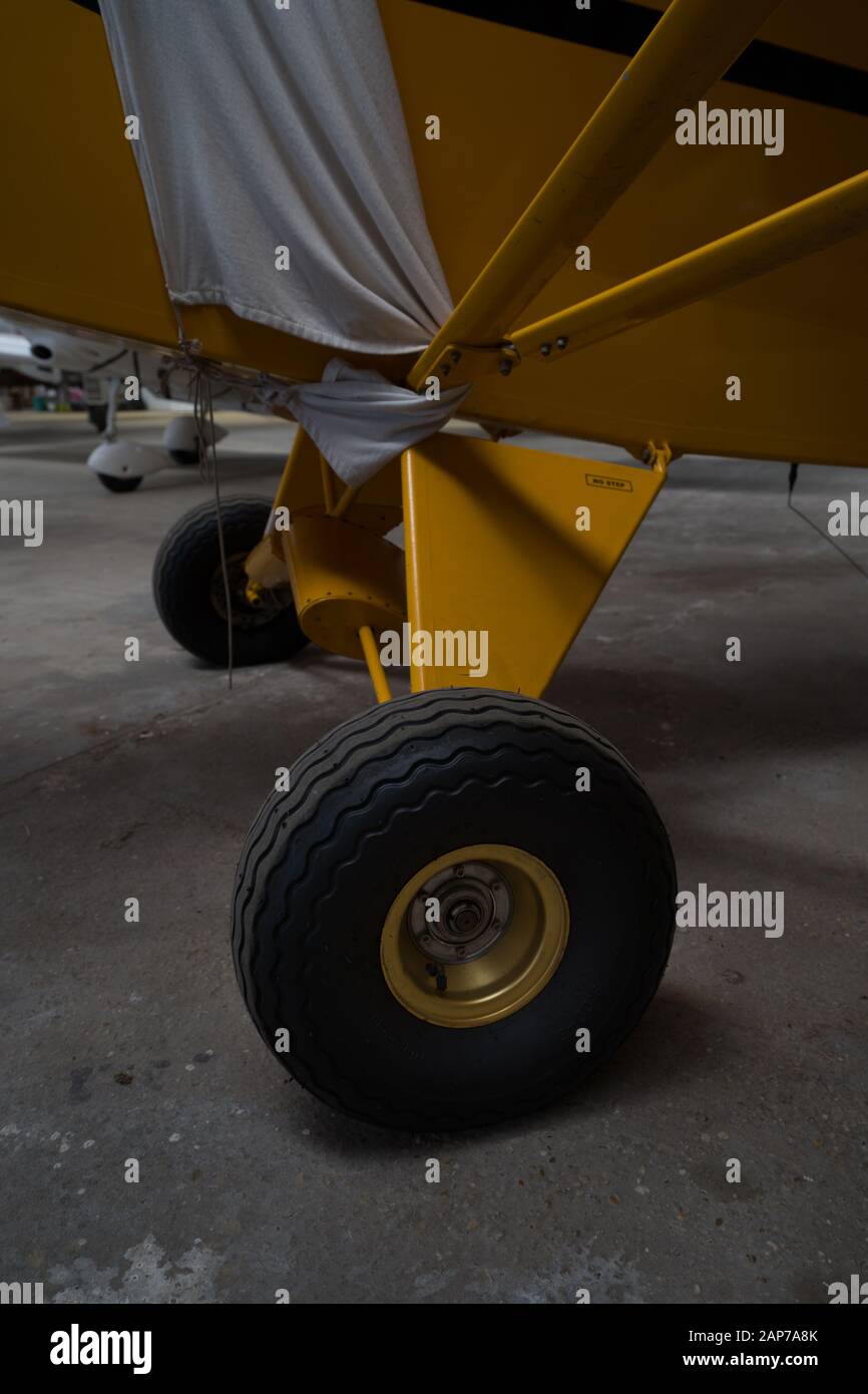Microlight Ultralight aircraft yellow wheel Stock Photo - Alamy