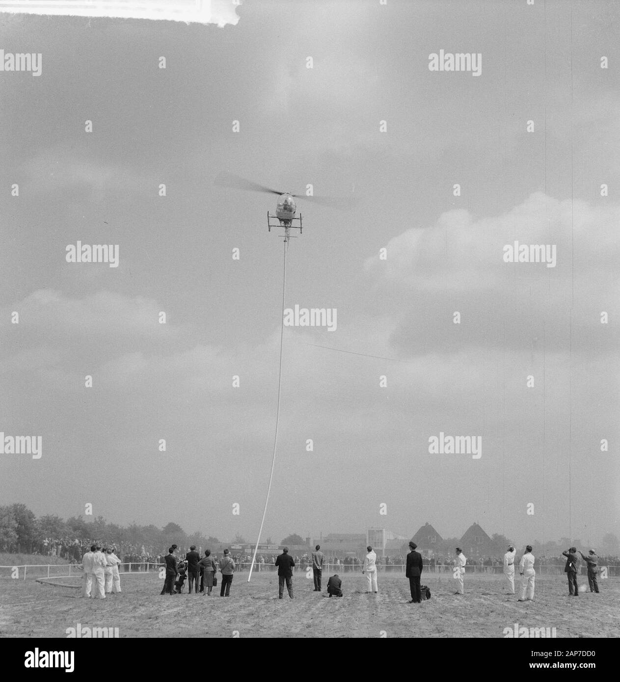 Pipe transport by air by helicopter. Helicopter with the tube Date: May ...