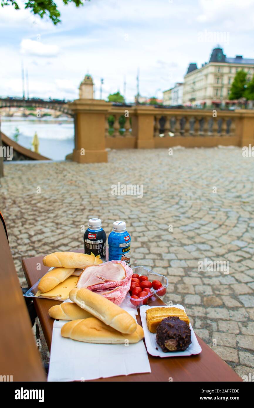 Fast food tourist. Buns and sausage. Food on a bench in a park Stock ...
