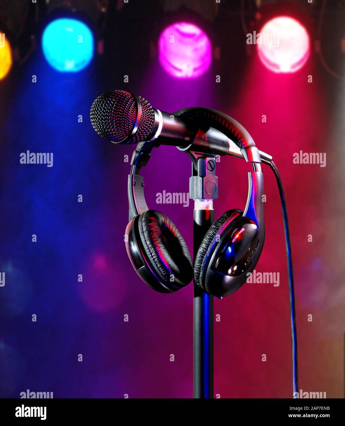 Live on colorful stage lights singers microphone and headset Stock ...
