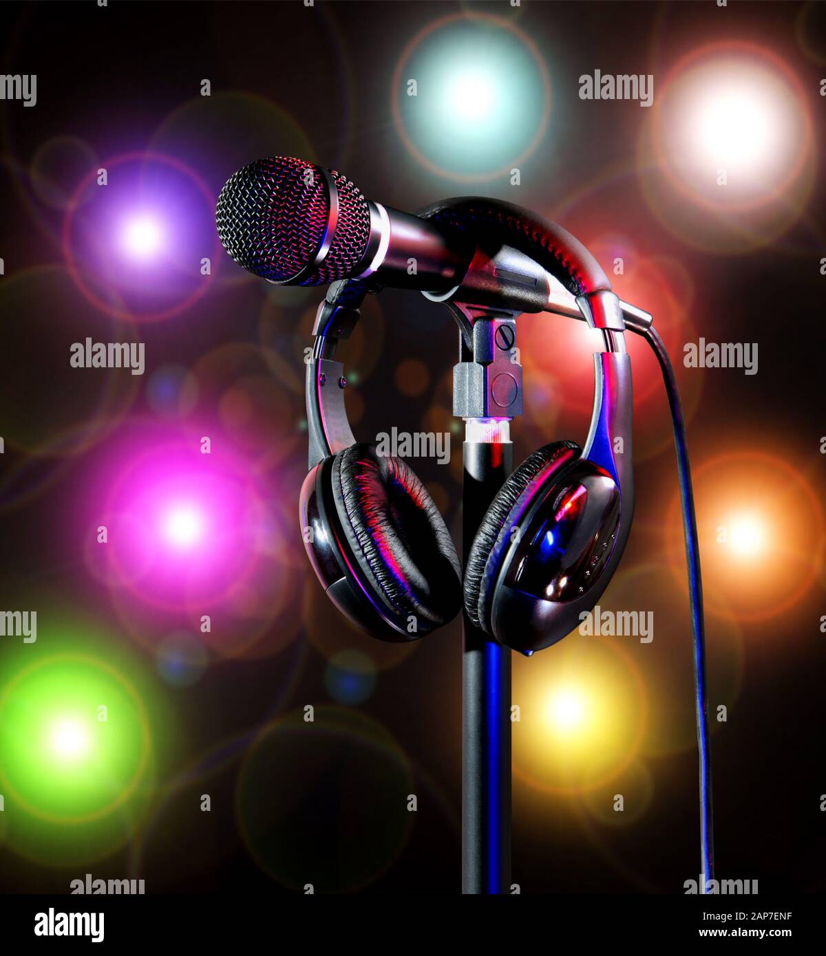 Live on colorful stage lights singers microphone and headset Stock ...