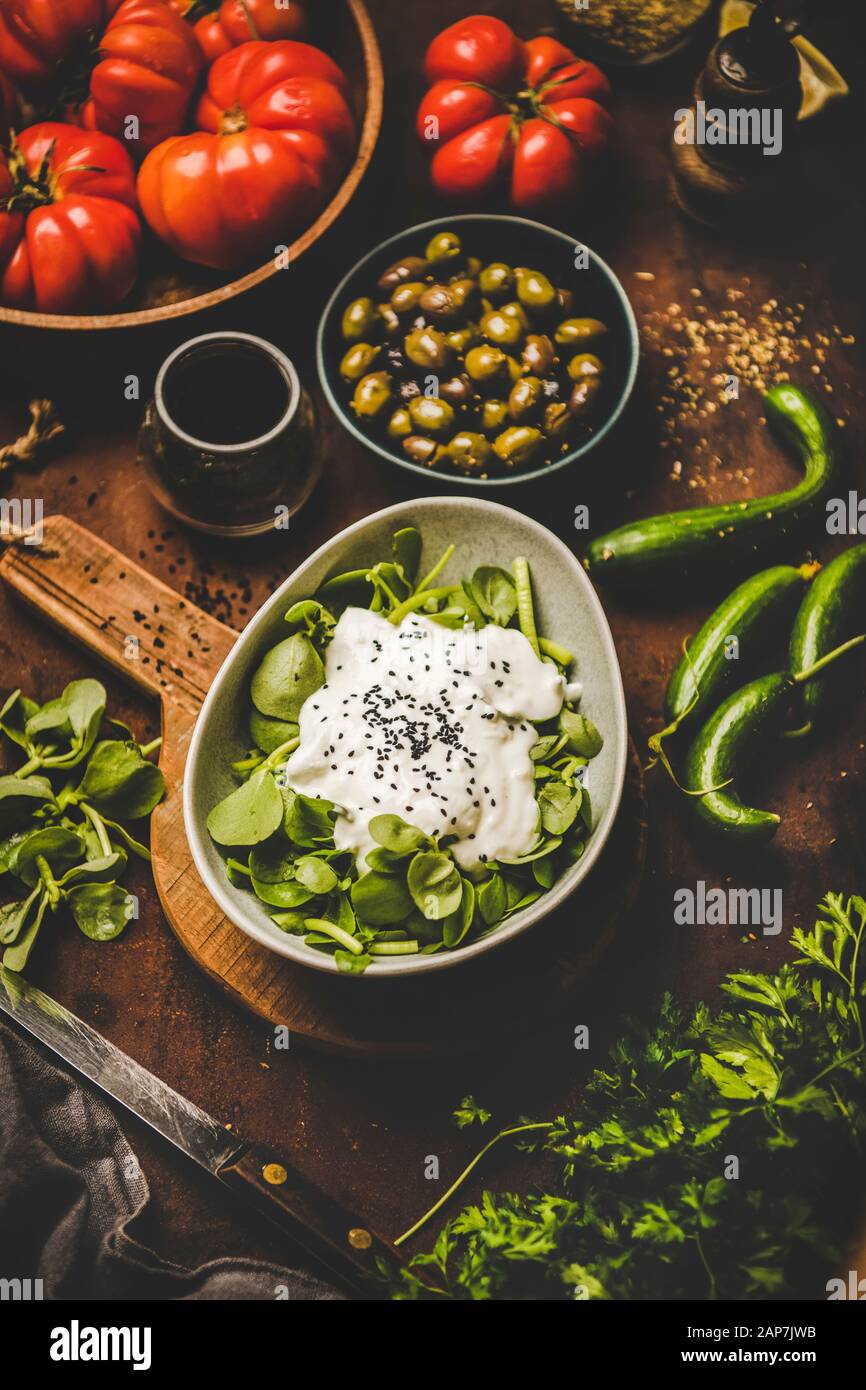 Turkish starter, meze dish. Bowl of fresh green purslane salad with ...