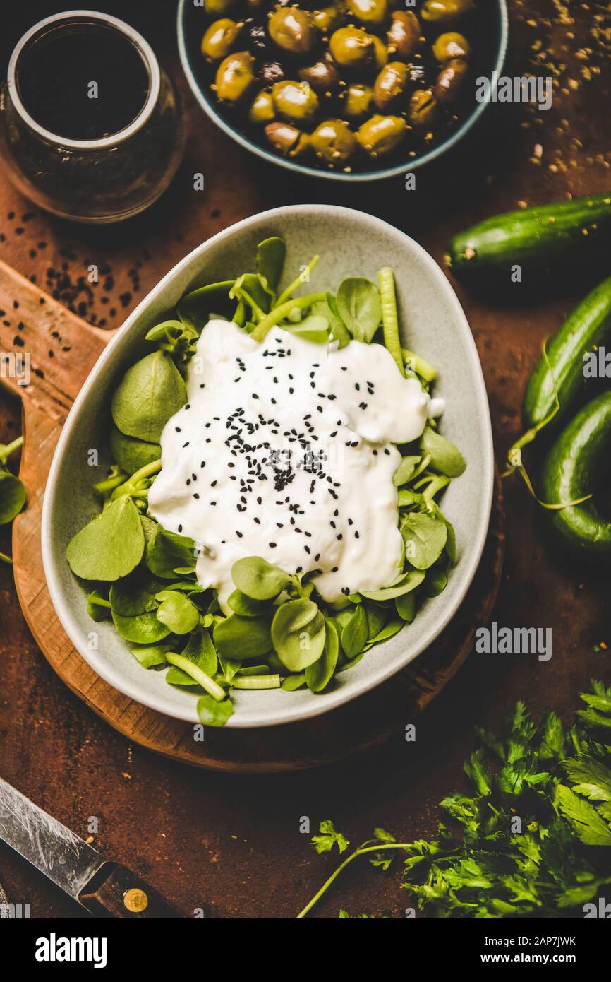 Turkish starter, meze dish. Bowl of fresh green purslane salad with ...