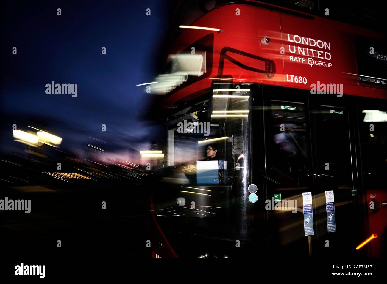 London Bus TFL Transport for London crossing Westminster Bridge dusk ...