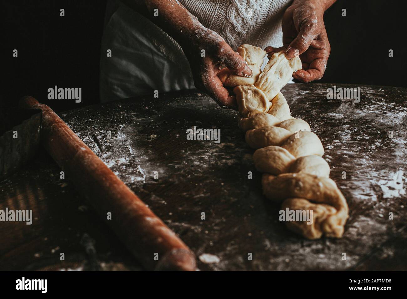 A Woman Prepares Homemade Braided Bread at Home Stock Photo - Alamy