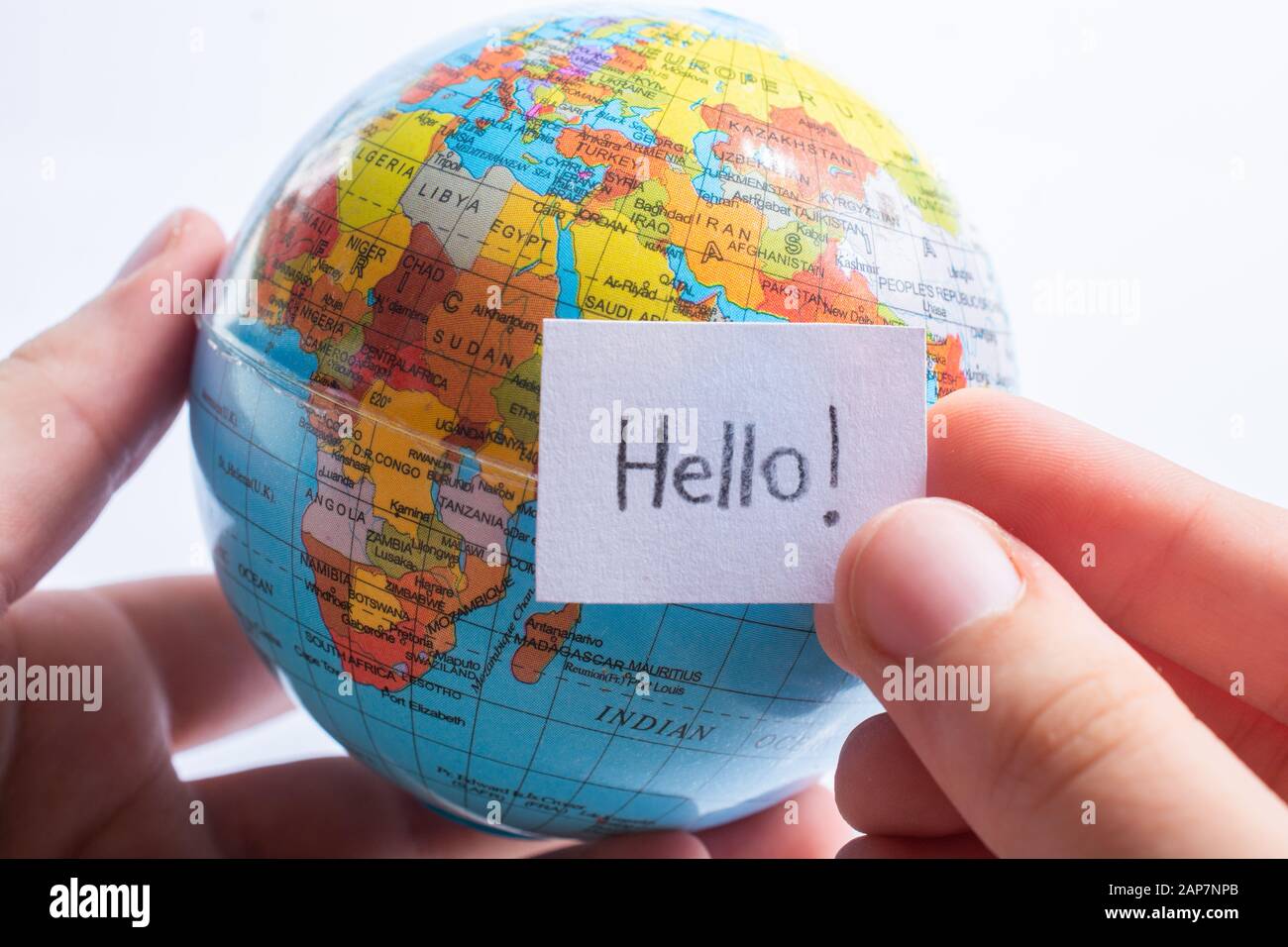Hand holding notepaper with HELLO wording on model globe Stock Photo ...