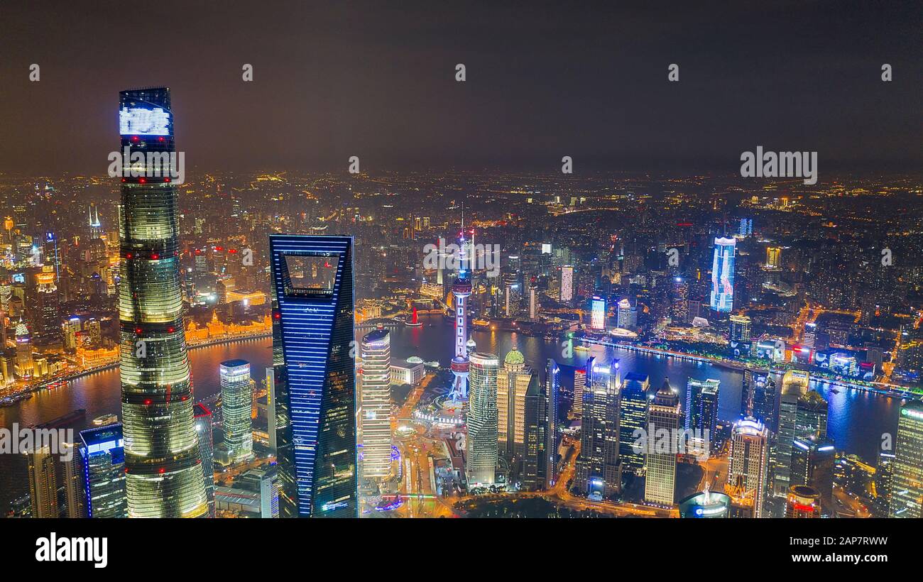 aerial view of Shanghai towers and tall buildings lighted up at night ...