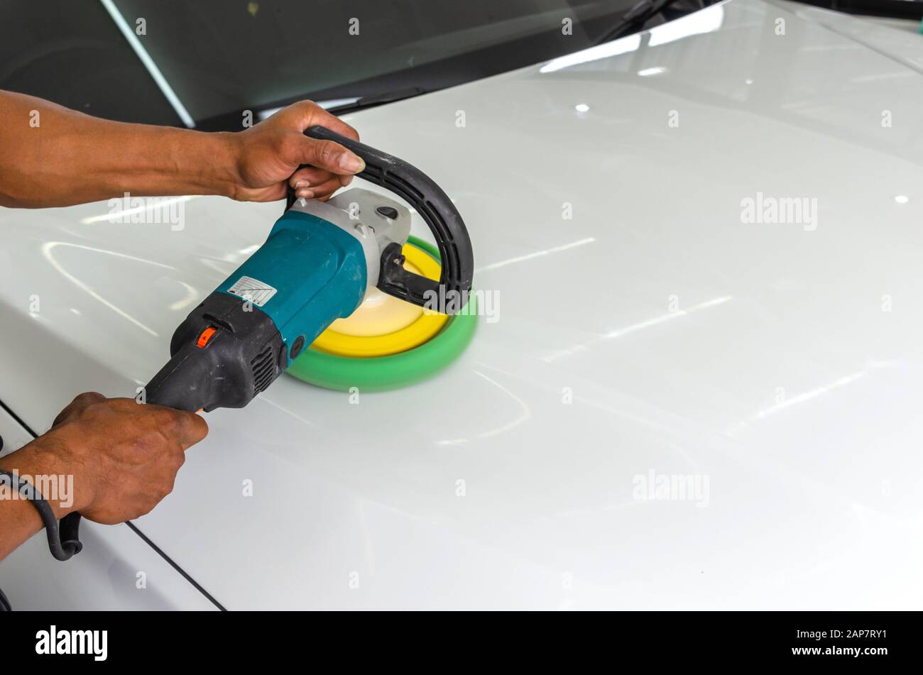 Man hands holding the work tool polish the car.Buffing and polishing ...