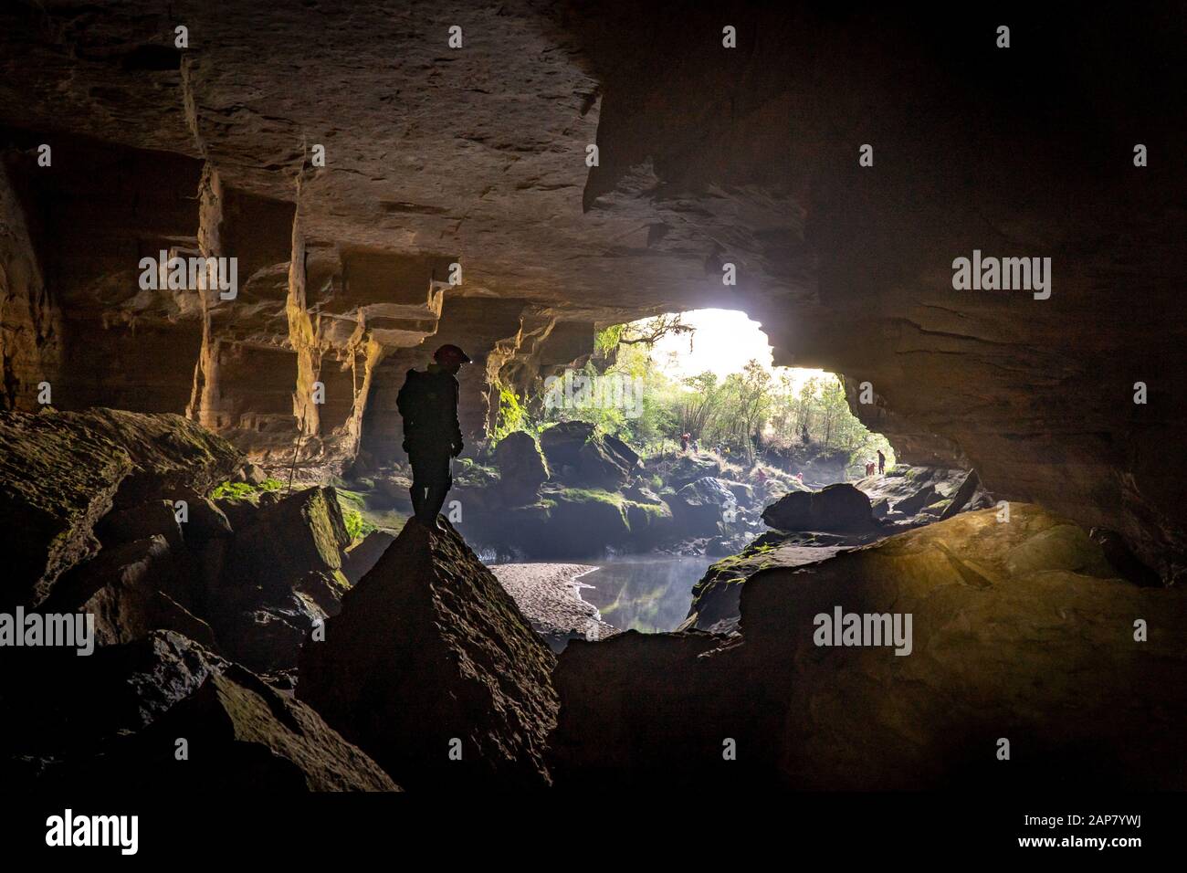 Man inside the cave Stock Photo - Alamy