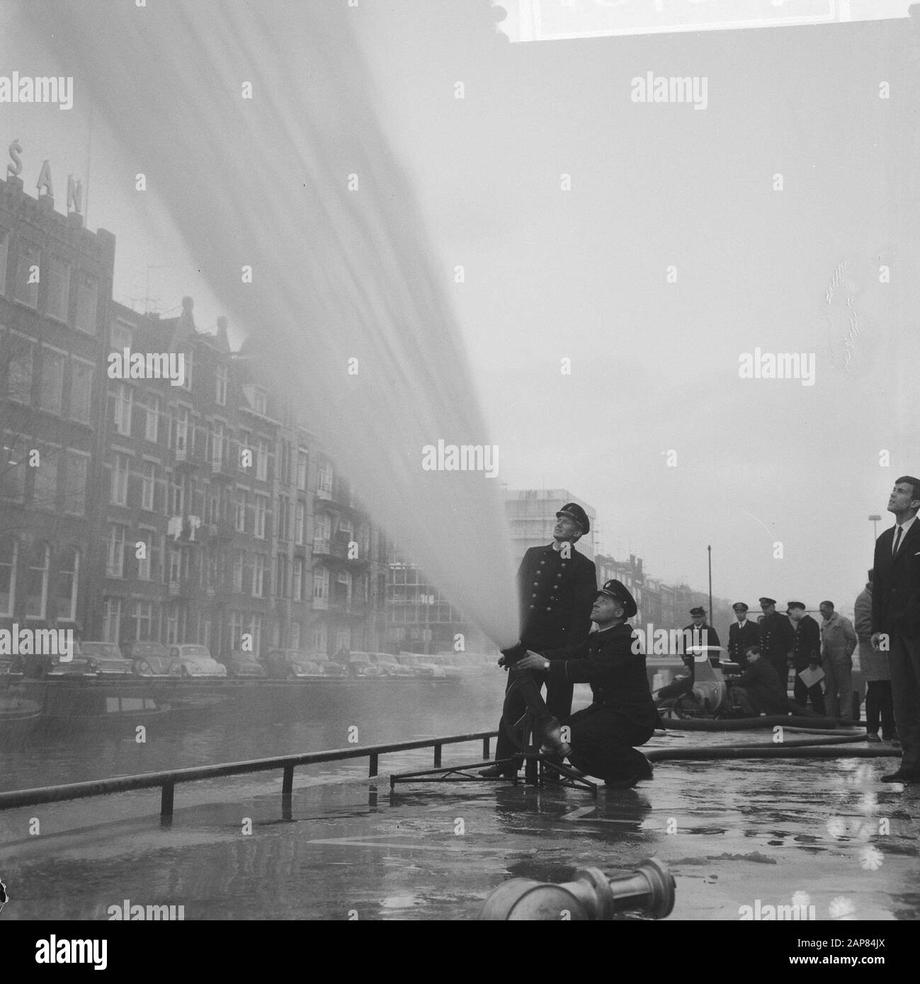 Amsterdam fire brigade during the demonstration of a water cannon ...