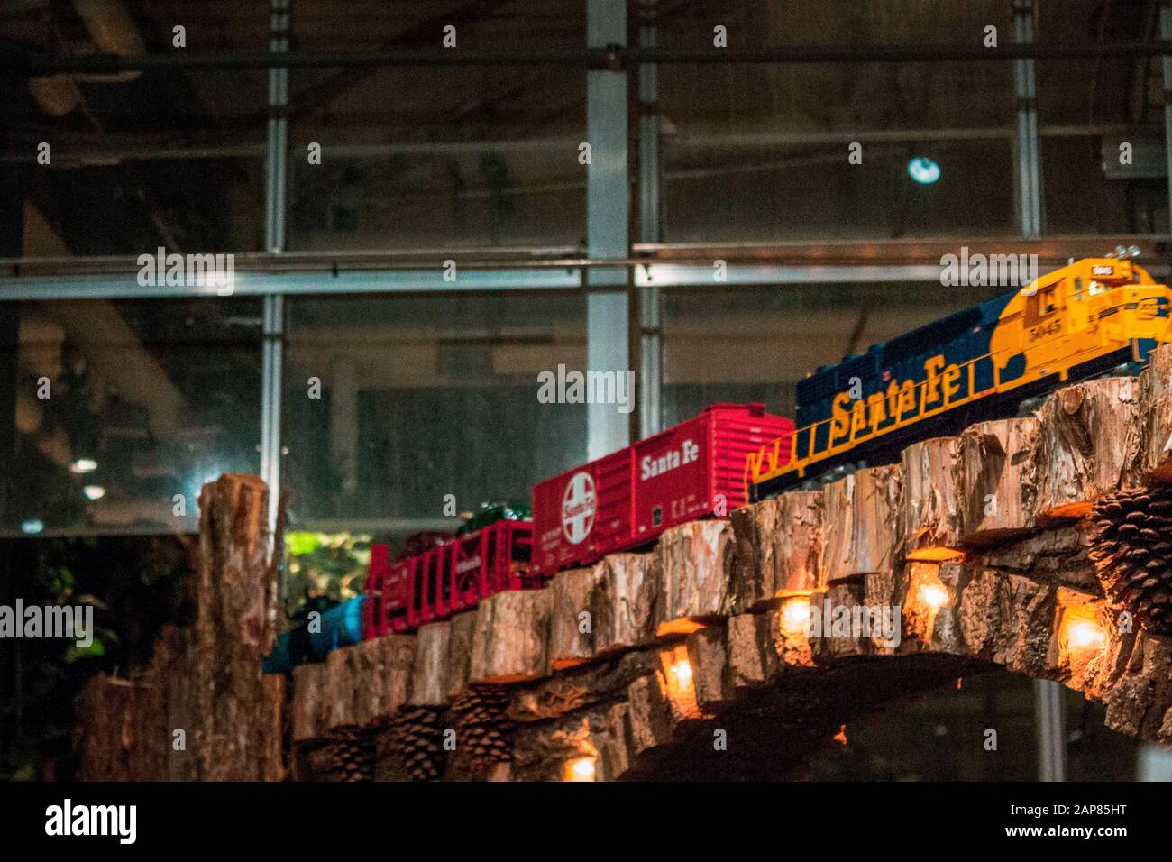 Model train running through the greenhouse at the railroad garden at ...