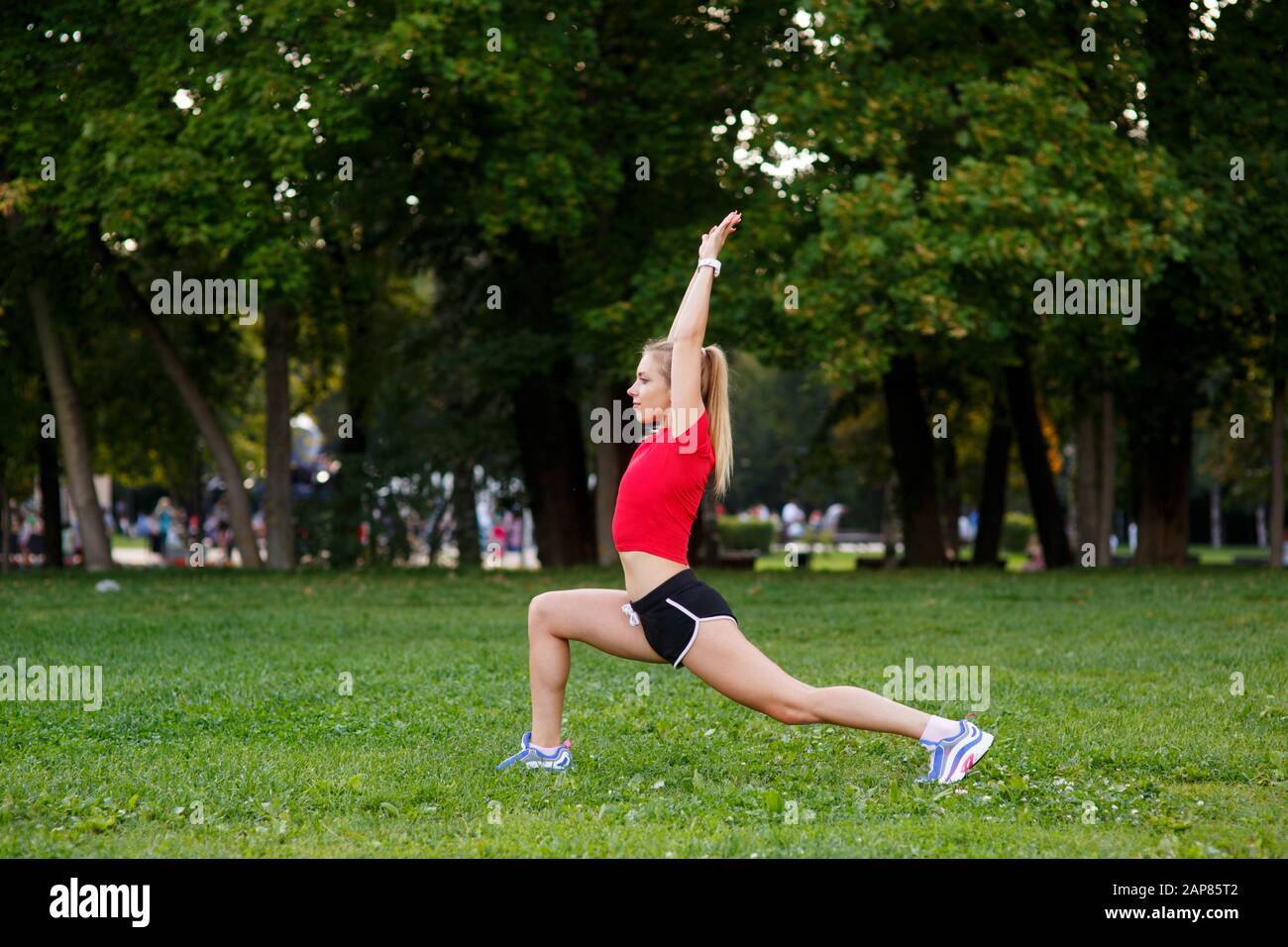 Girl doing lunges. Young slim woman doing lunges in a city park ... Girl doing lunges. Young slim woman doing lunges in a city park ...