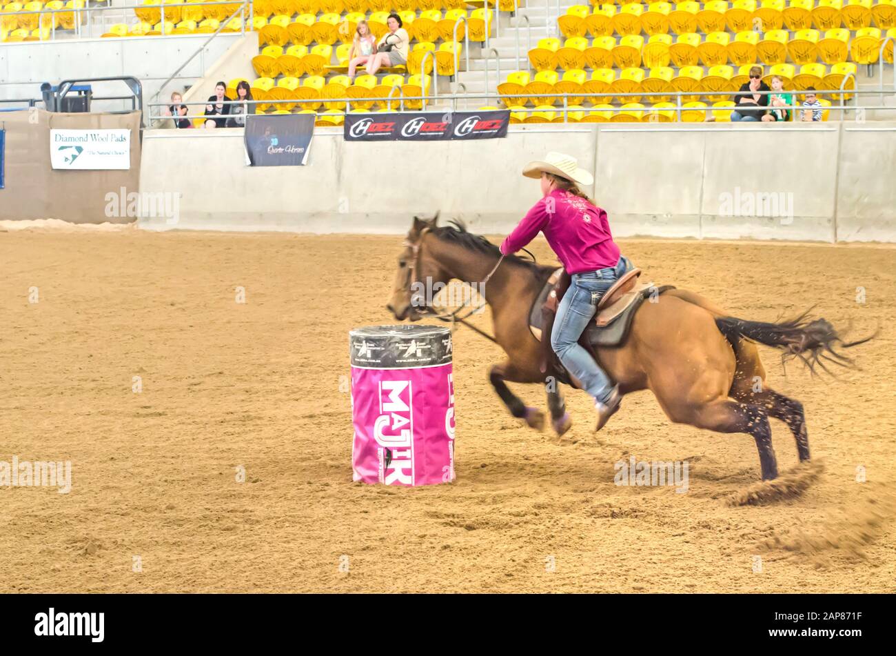 Female rider competing in a barrel race Stock Photo - Alamy