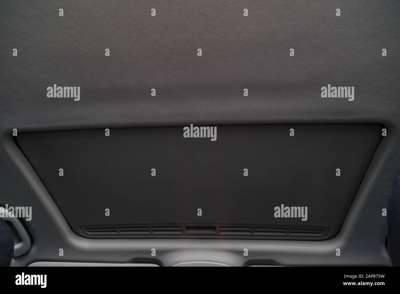 View of the ceiling of the car with a transparent glass hatch for ...