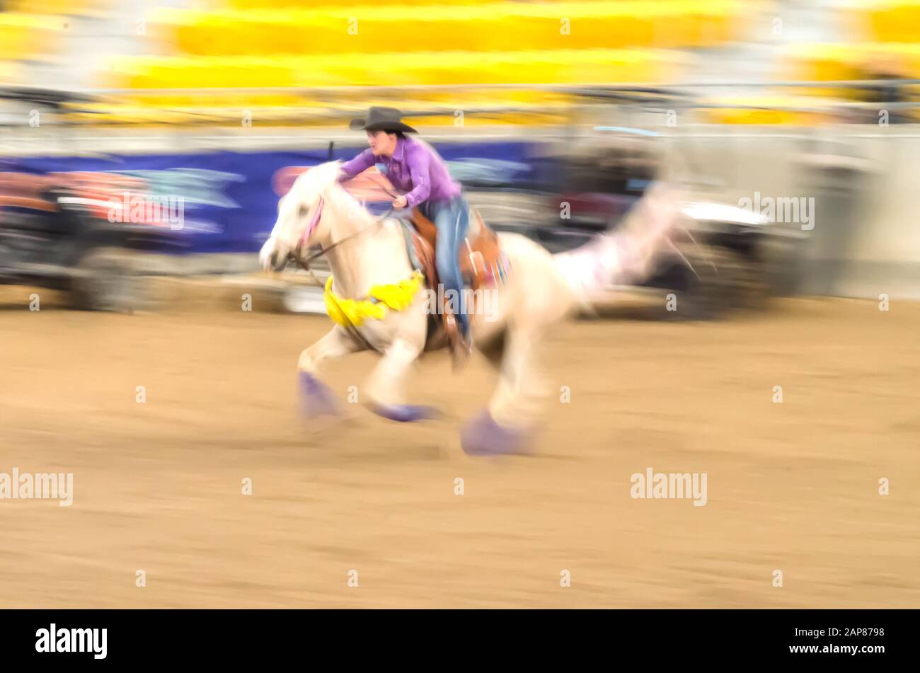 Slow shutter speed to capture movement at barrel race event at an ...