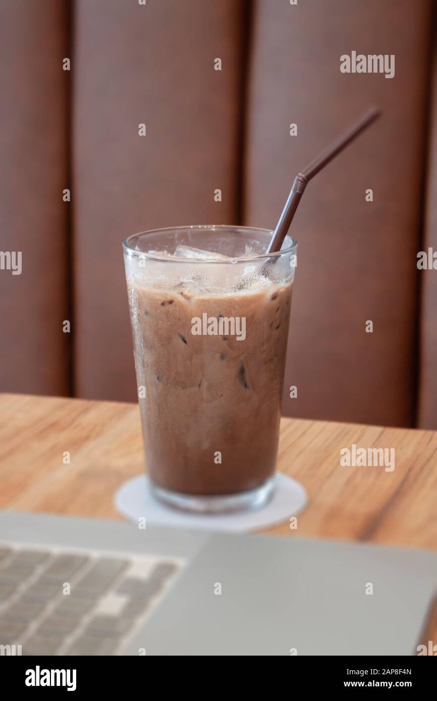 Iced coffee in coffee shop on wooden table, stock photo Stock Photo - Alamy