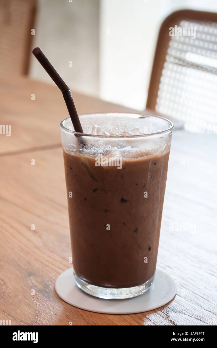 Iced coffee in coffee shop on wooden table, stock photo Stock Photo - Alamy