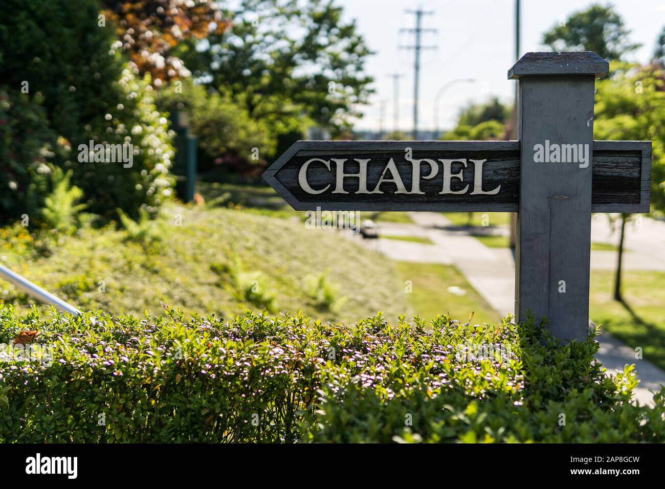 Chapel sign made from wood on a sidewalk in big city Stock Photo - Alamy