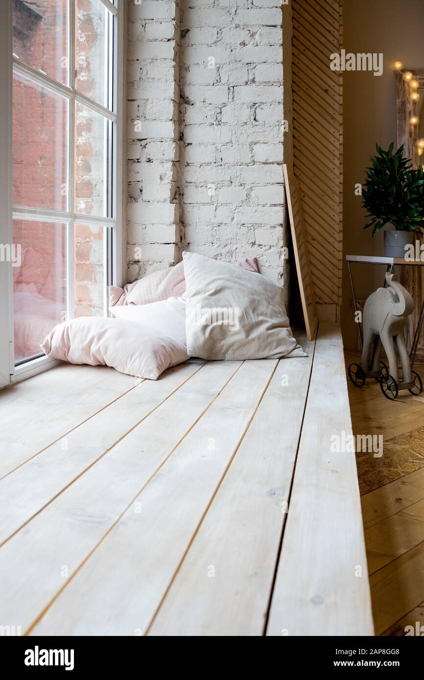 Bright photo studio interior with big window, high ceiling, wooden ...