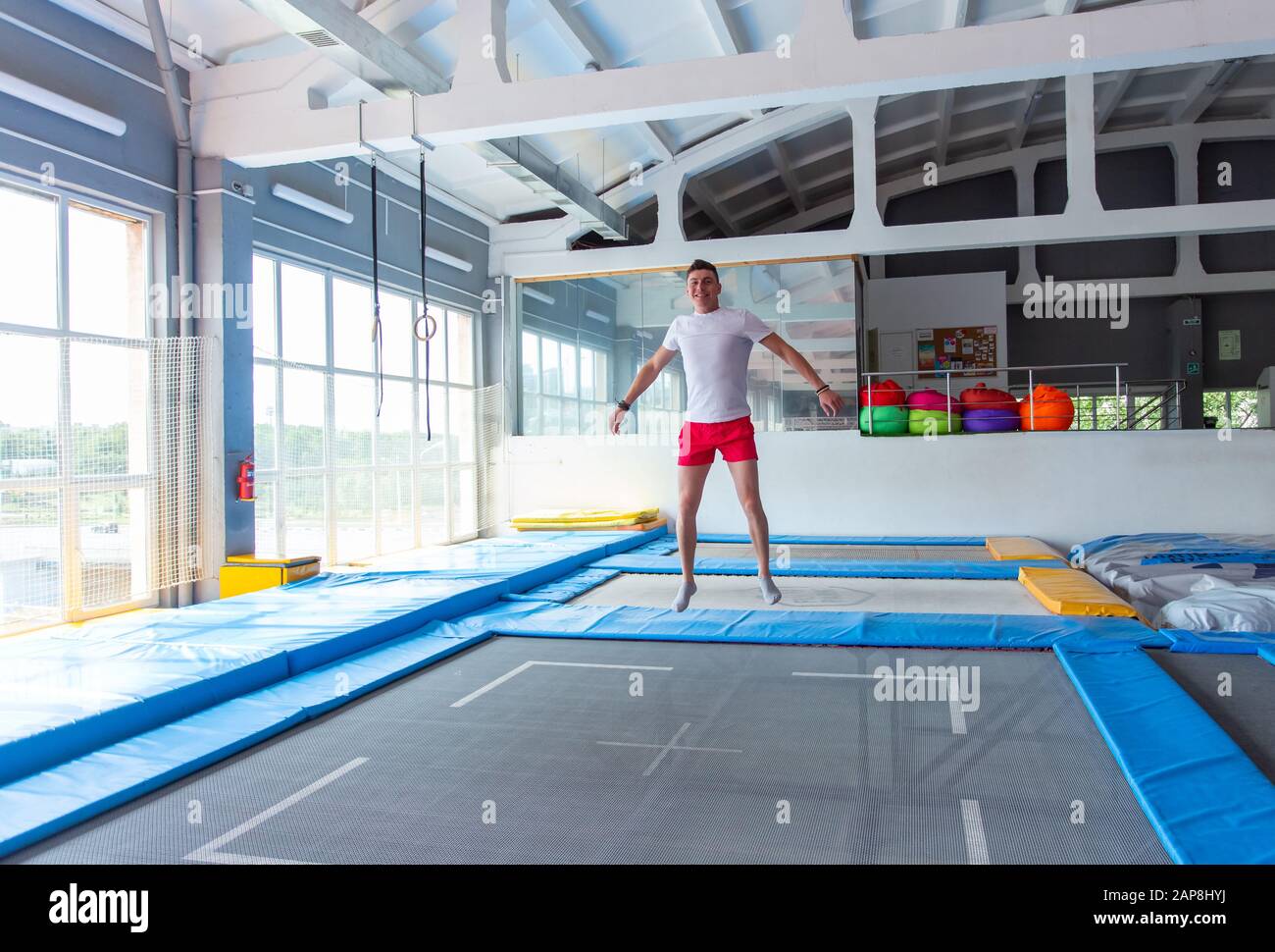 Fitness, fun, leisure and sport activity concept - Handsome happy man ...