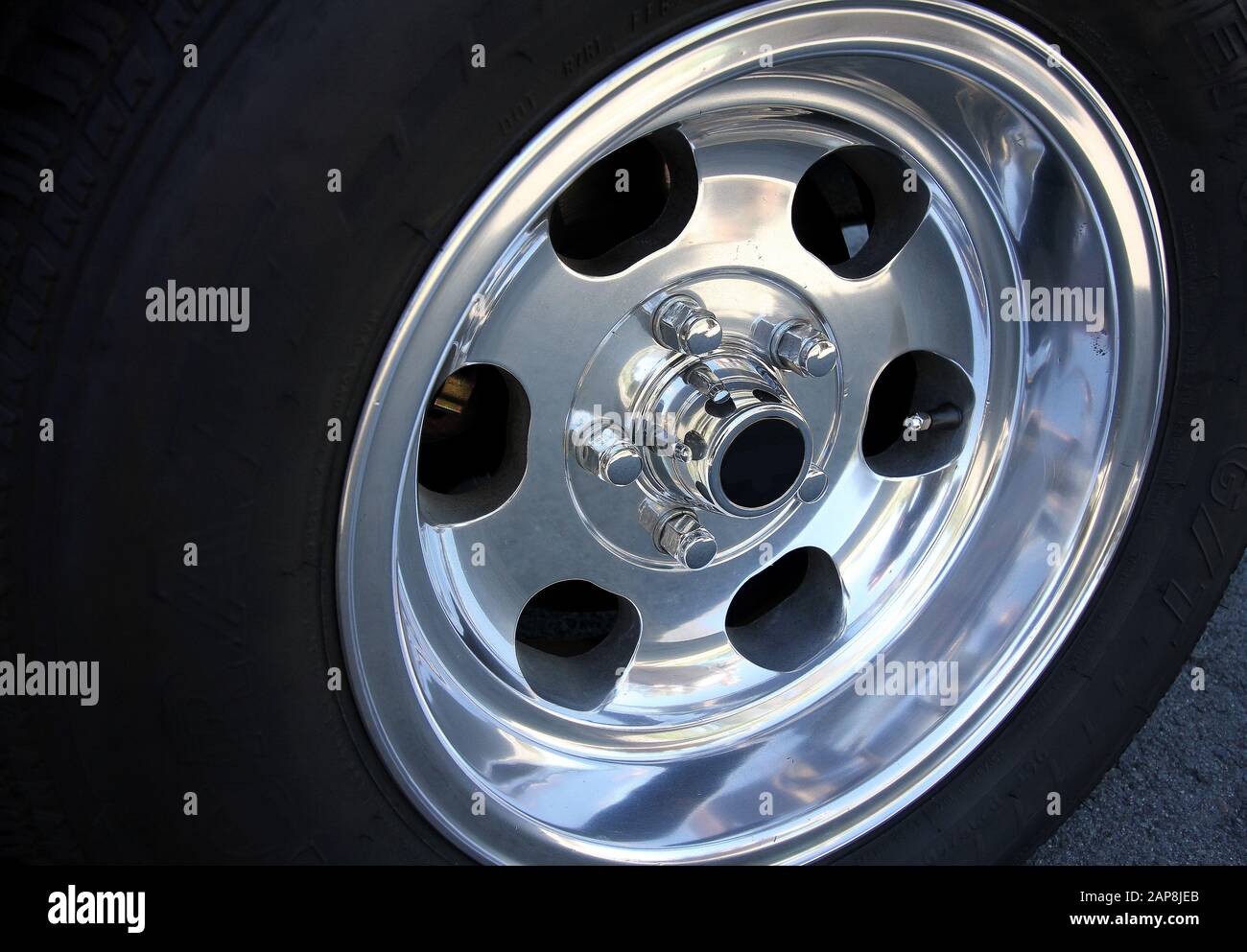 Classic cars: A tight shot of a chrome rim off a classic muscle car ...