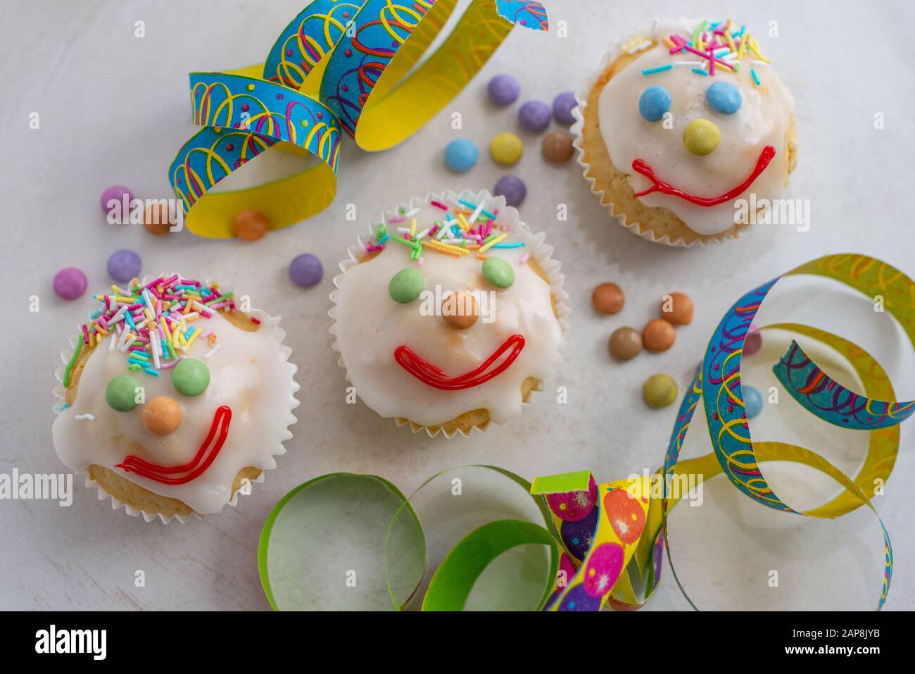 carnival clown muffins decorated with multi colored chocolate lentils ...