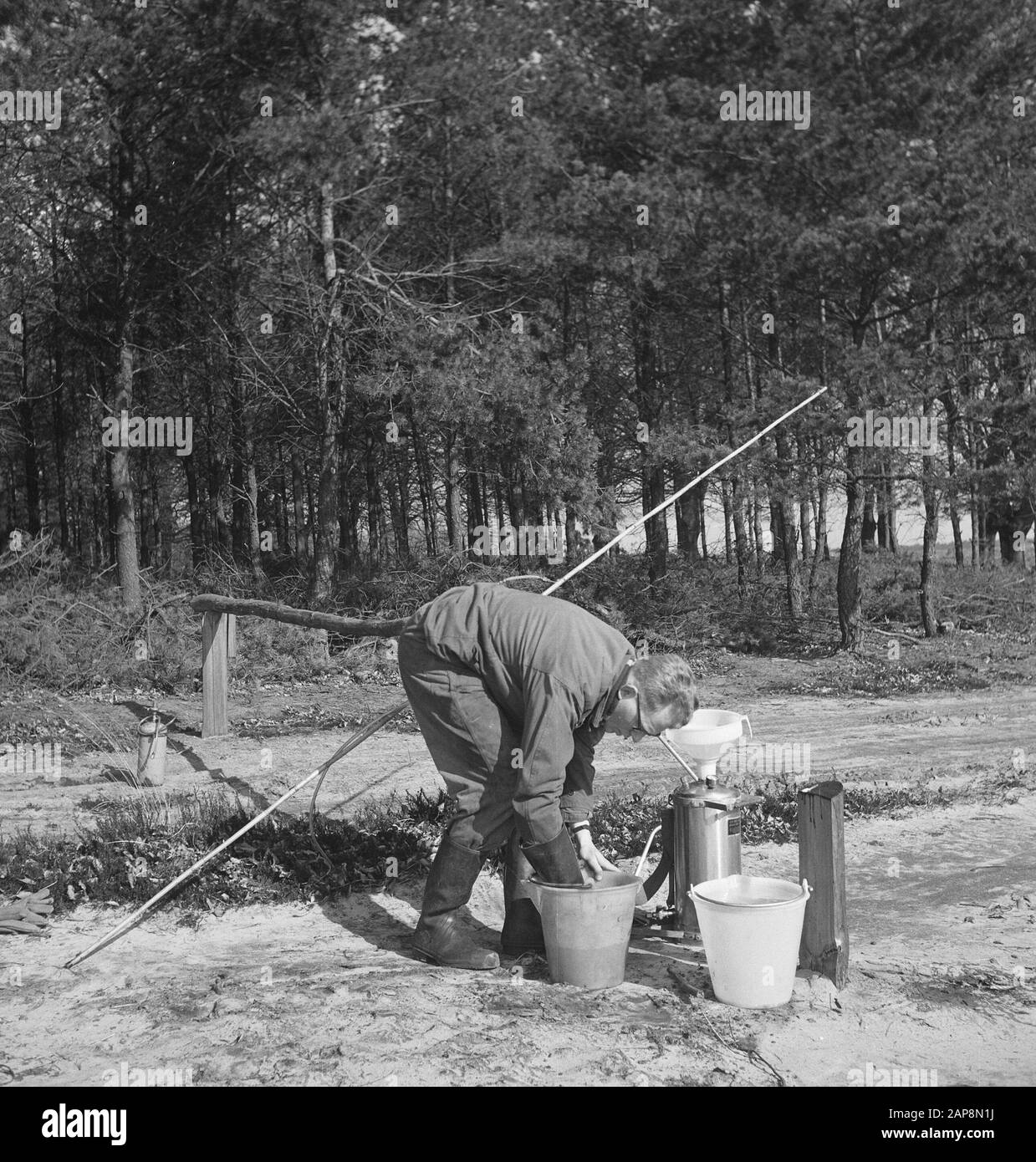 workers, spray installations, buckets, funnels, filling works Date ...