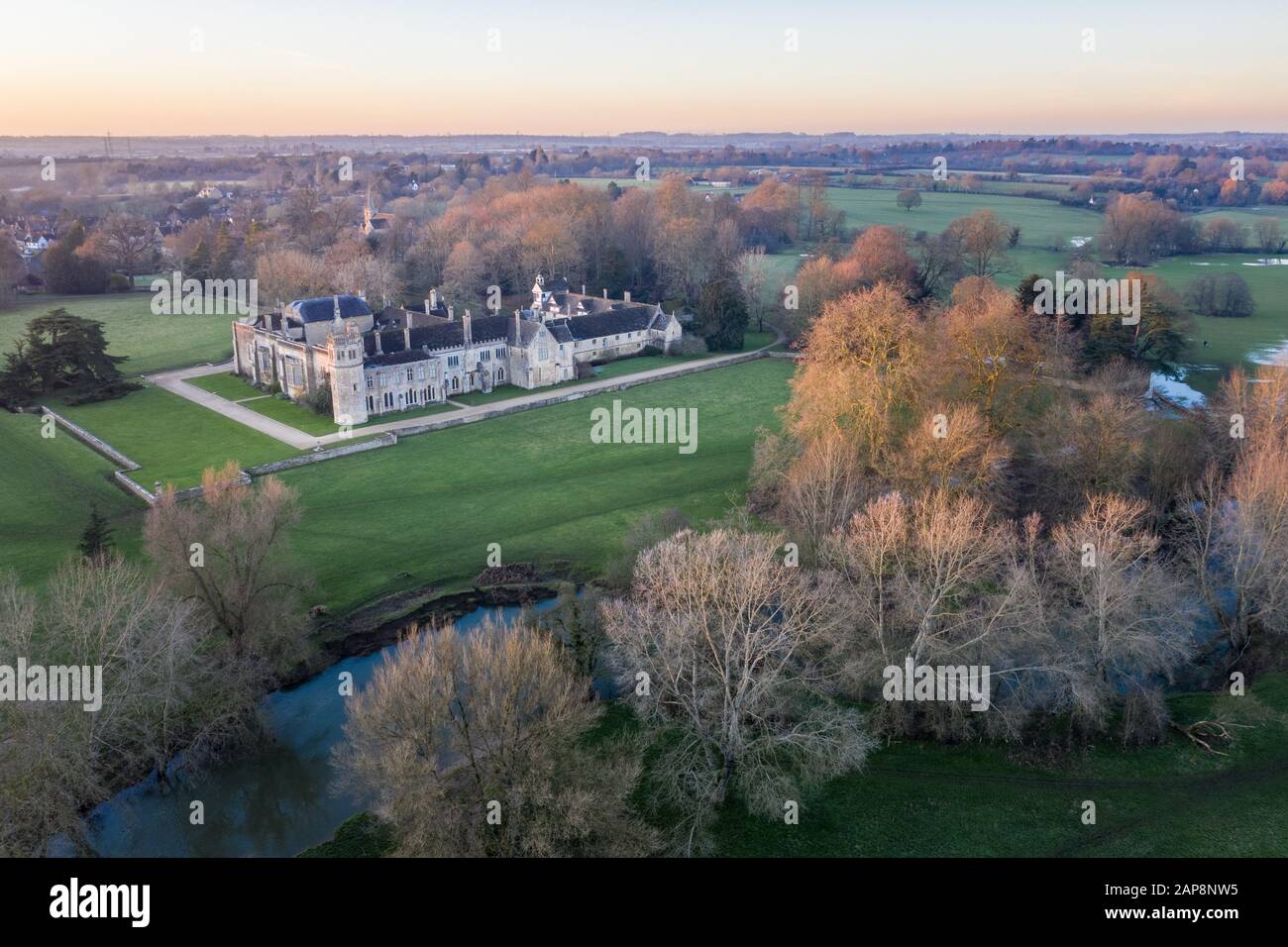 Lacock Abbey, Lacock, Wiltshire, UK. January 2020. The sun sets on ...