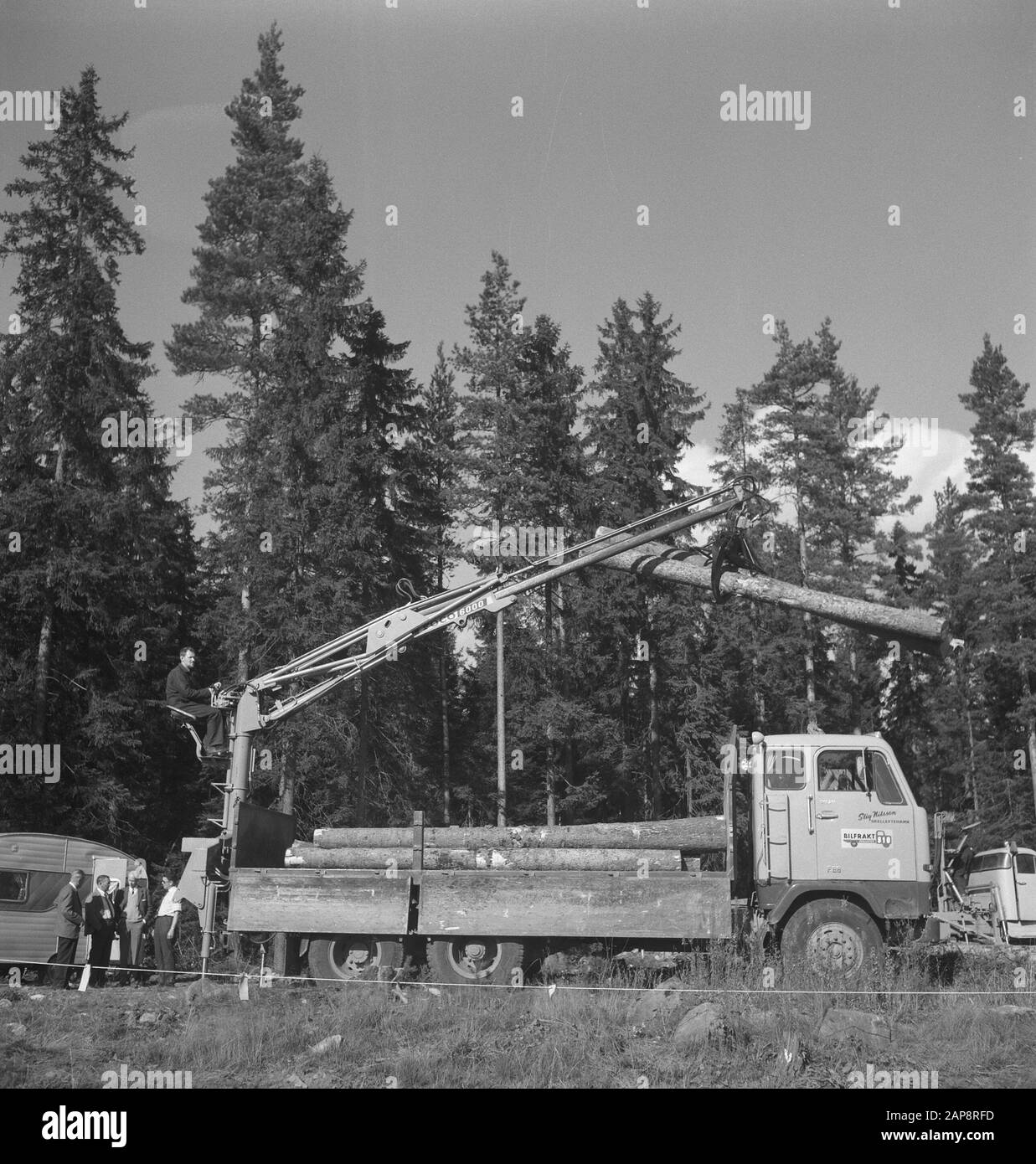 forestry, tow trucks, tree trunks, workers, hoist work Date: undated ...