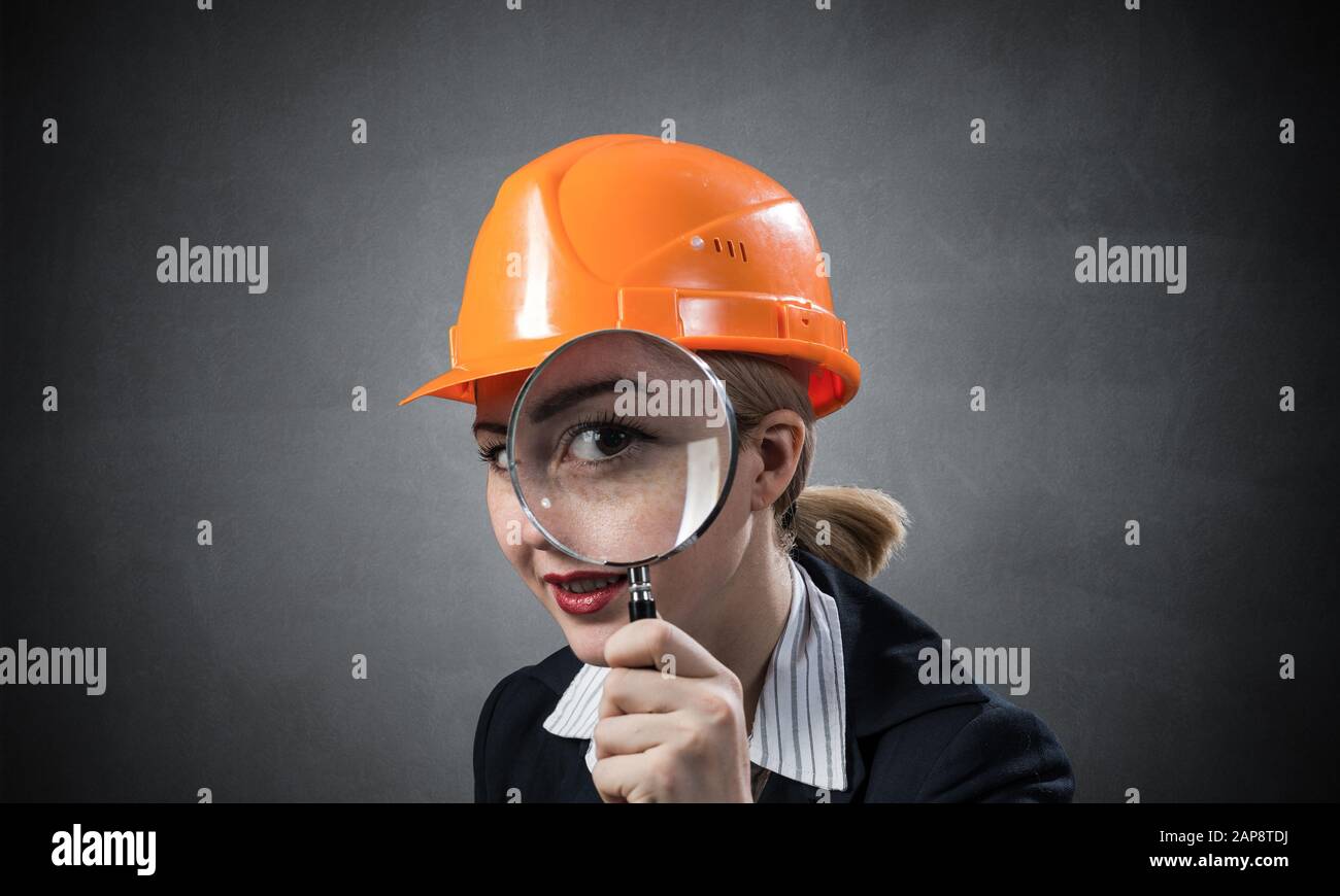 Technical inspector looking through magnifier Stock Photo - Alamy