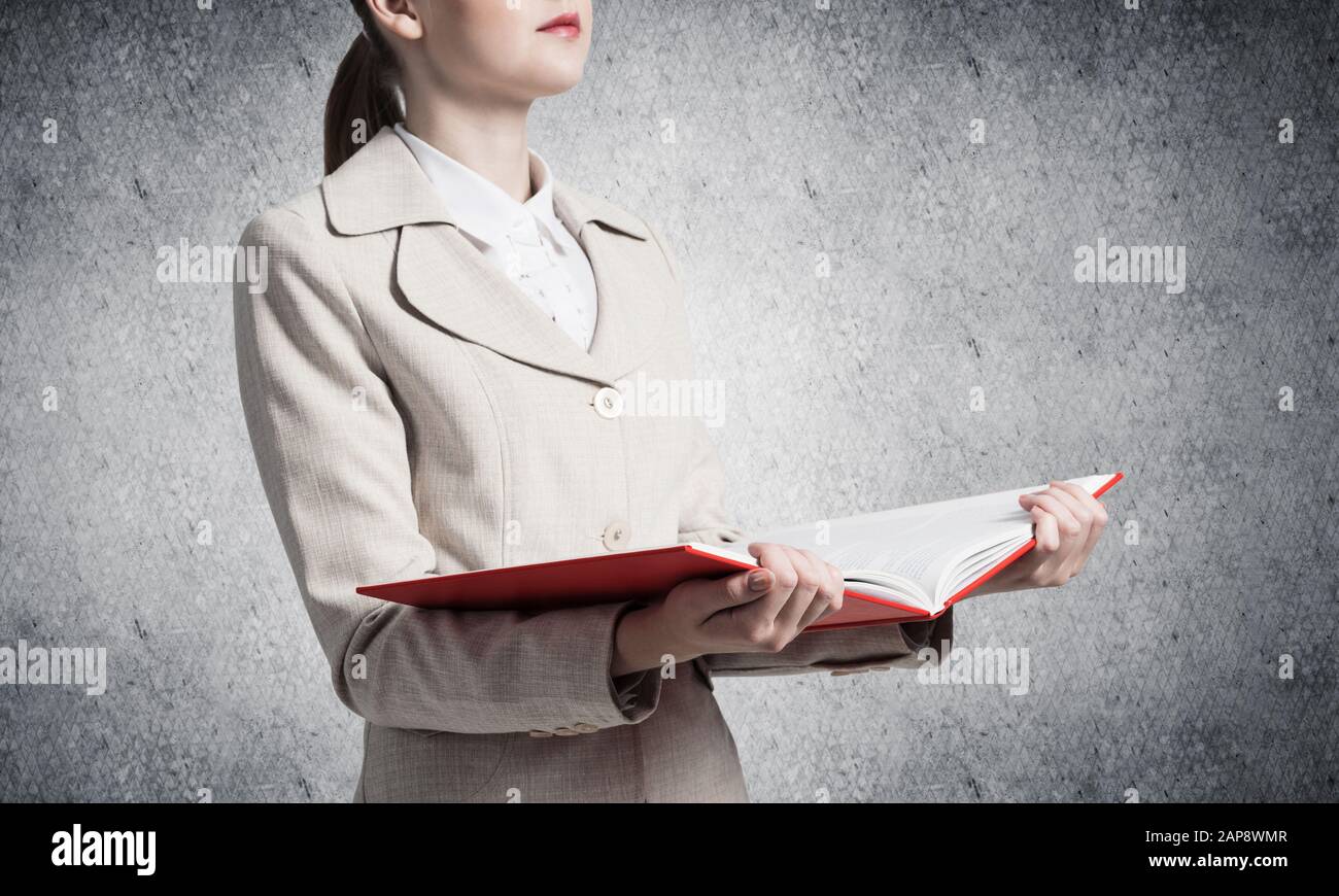 Corporate employee holding open notebook Stock Photo - Alamy