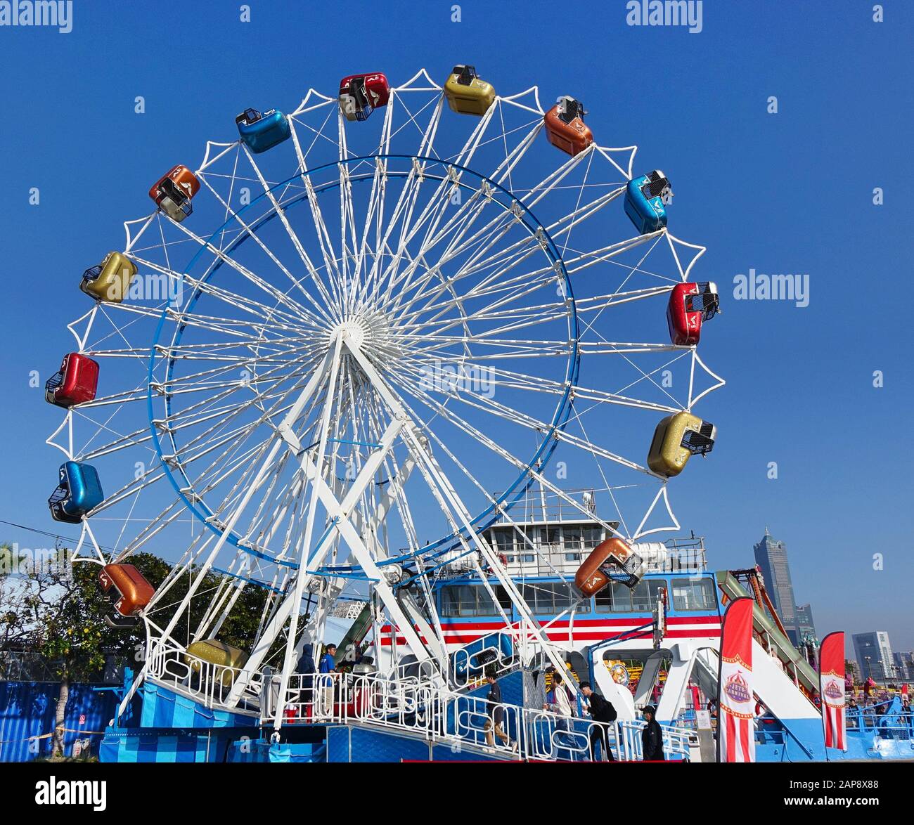KAOHSIUNG, TAIWAN -- JANUARY 11, 2020: A ferris wheel with colorful ...