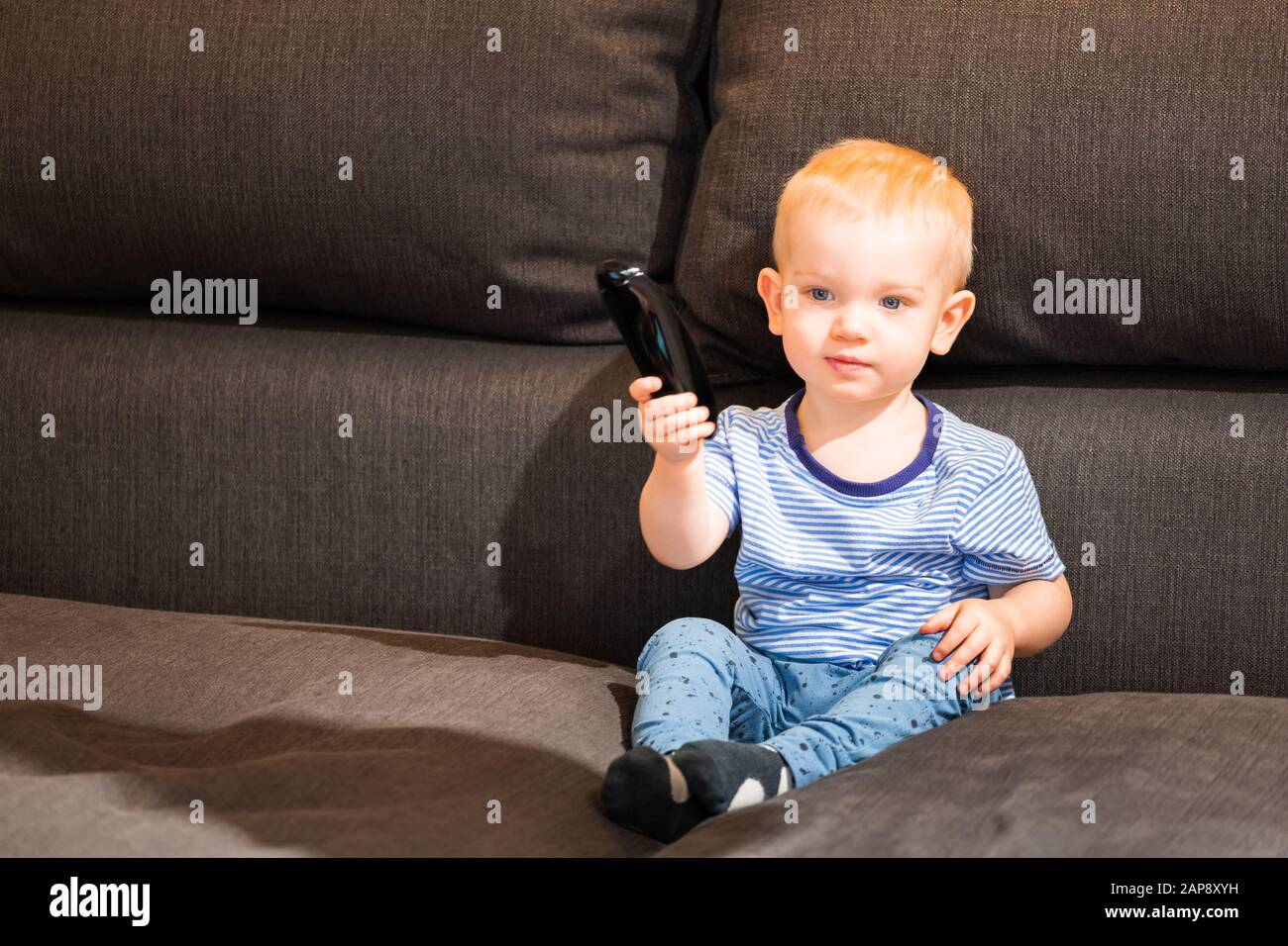 Little boy watching tv Stock Photo - Alamy