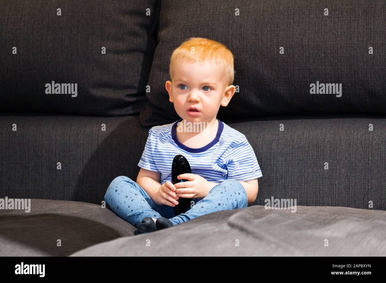 Little boy watching tv Stock Photo - Alamy