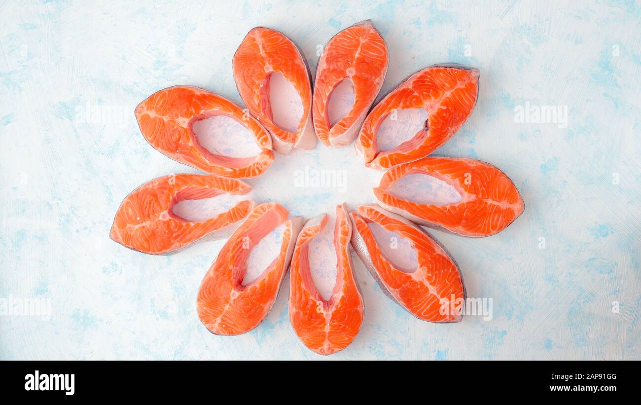 fresh uncooked red fish fillet over white Stock Photo - Alamy