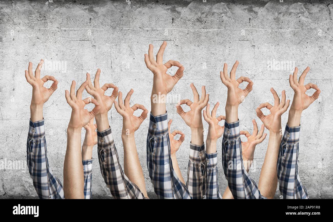 Row of man hands showing okay gesture Stock Photo - Alamy