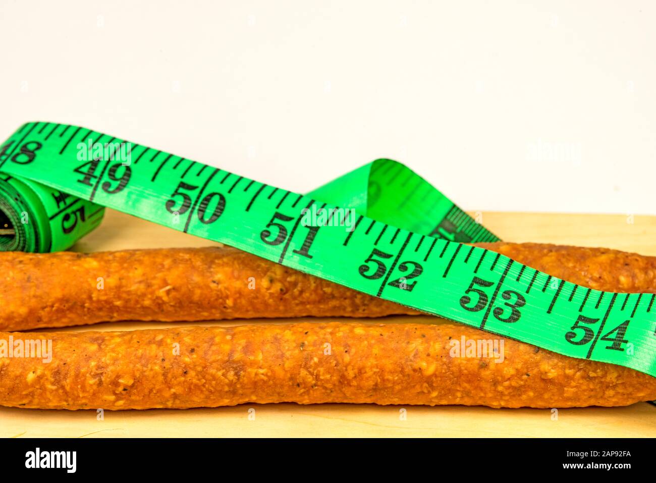 sausage with a tape measure Stock Photo - Alamy
